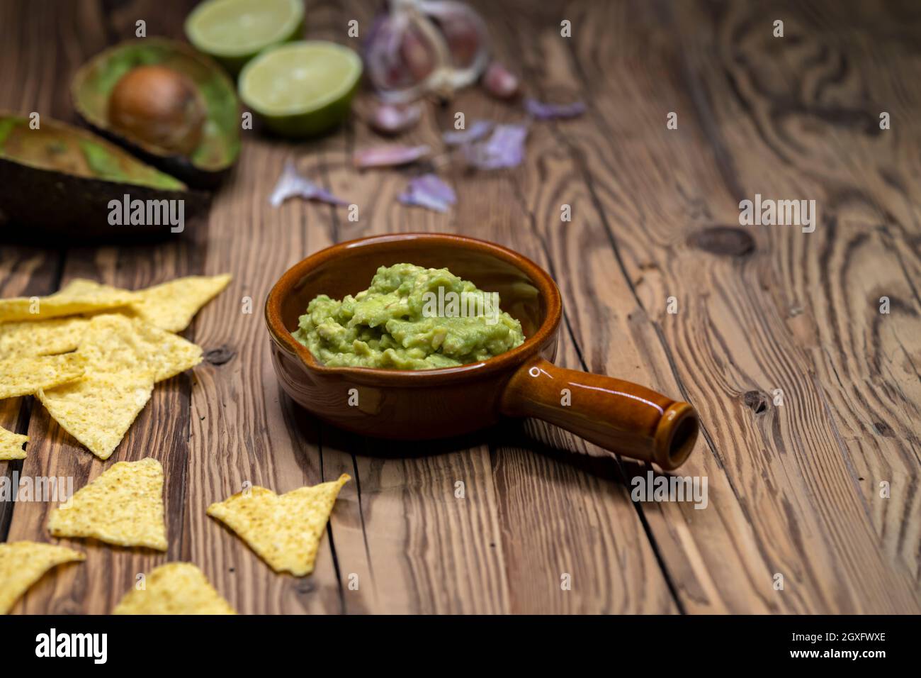 avocado dip flavored with garlic, chili, pepper, and lime juice with ...