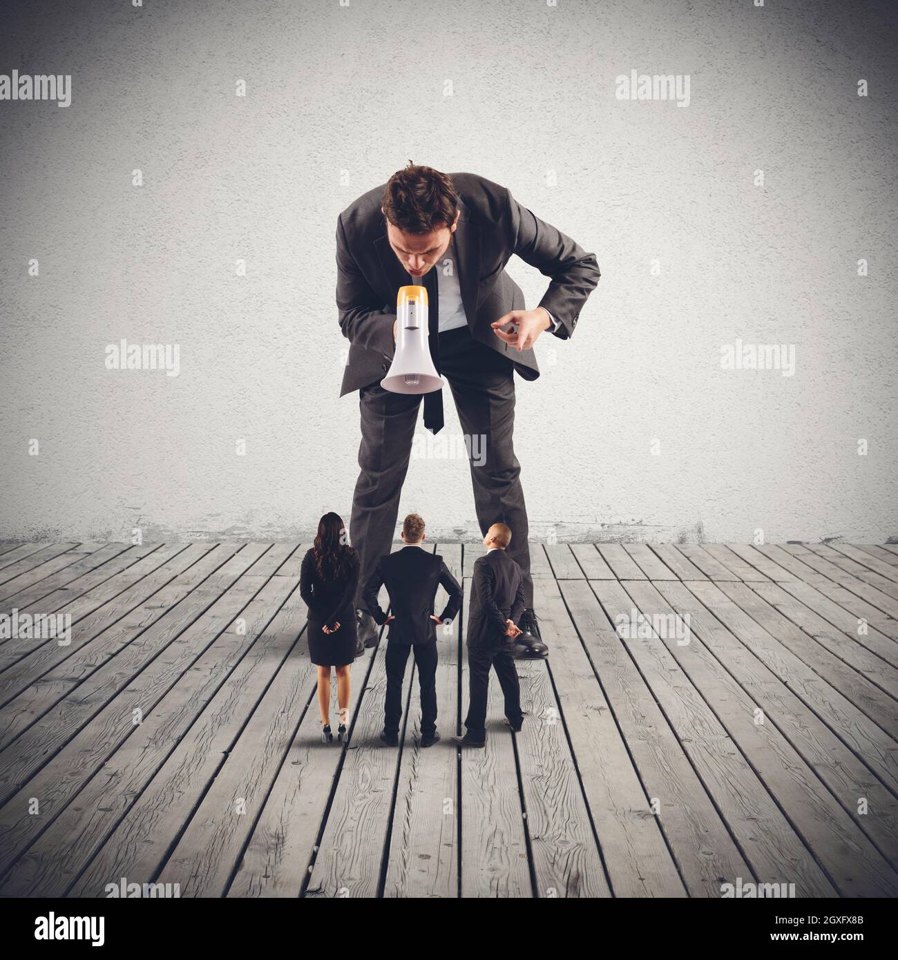 Big authoritative person commands the subordinates with the megaphone ...