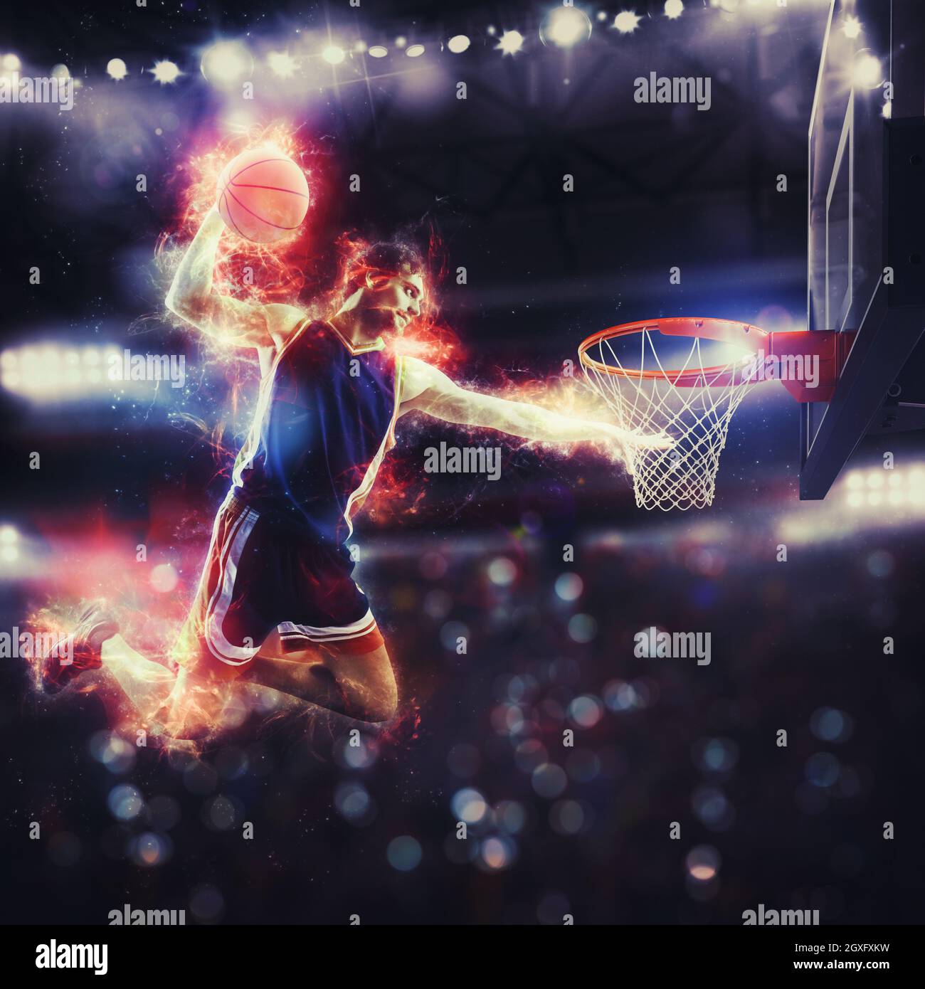 Basketball player slams dunk the ball to the basket Stock Photo - Alamy