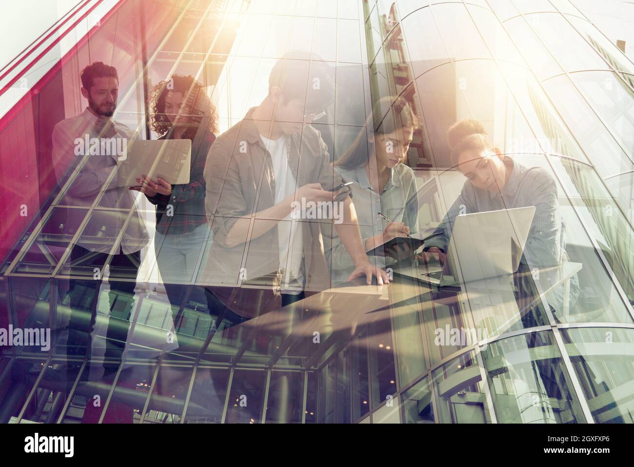 Business people collaborate together in a modern office. Double ...