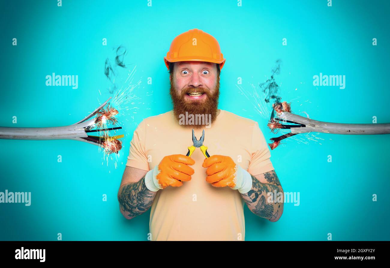 Incompetent worker electrician is unsure about his work Stock Photo - Alamy
