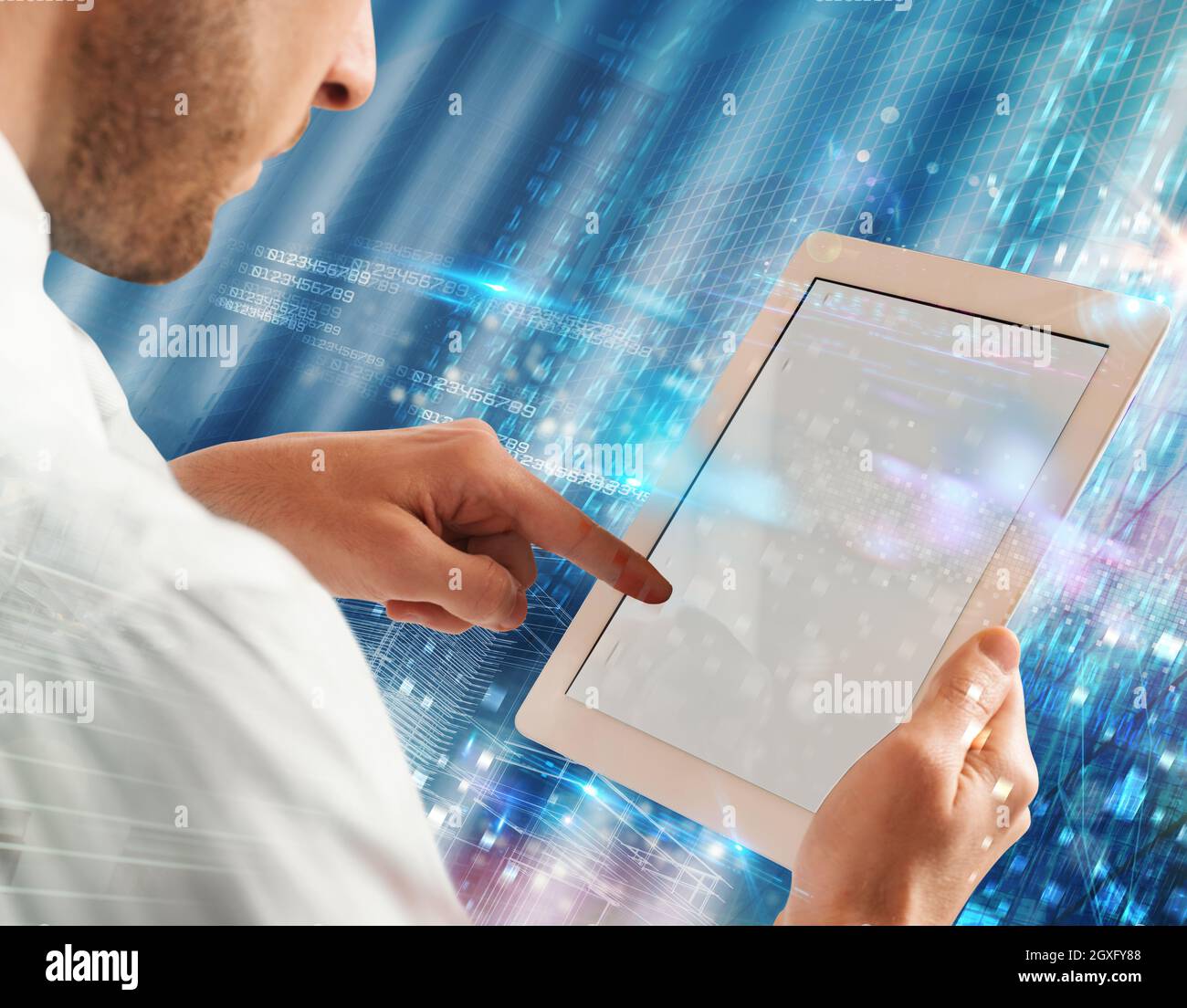 Businessman touching the screen of a tablet Stock Photo - Alamy
