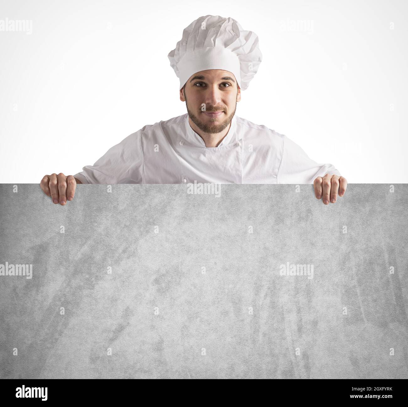 Chef showing his menu on a billboard Stock Photo - Alamy
