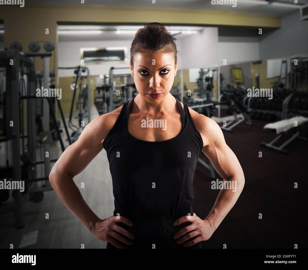 Woman with determined expression in a gym Stock Photo - Alamy