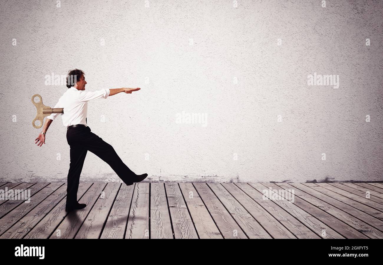 Man walks like a puppet with charge Stock Photo - Alamy