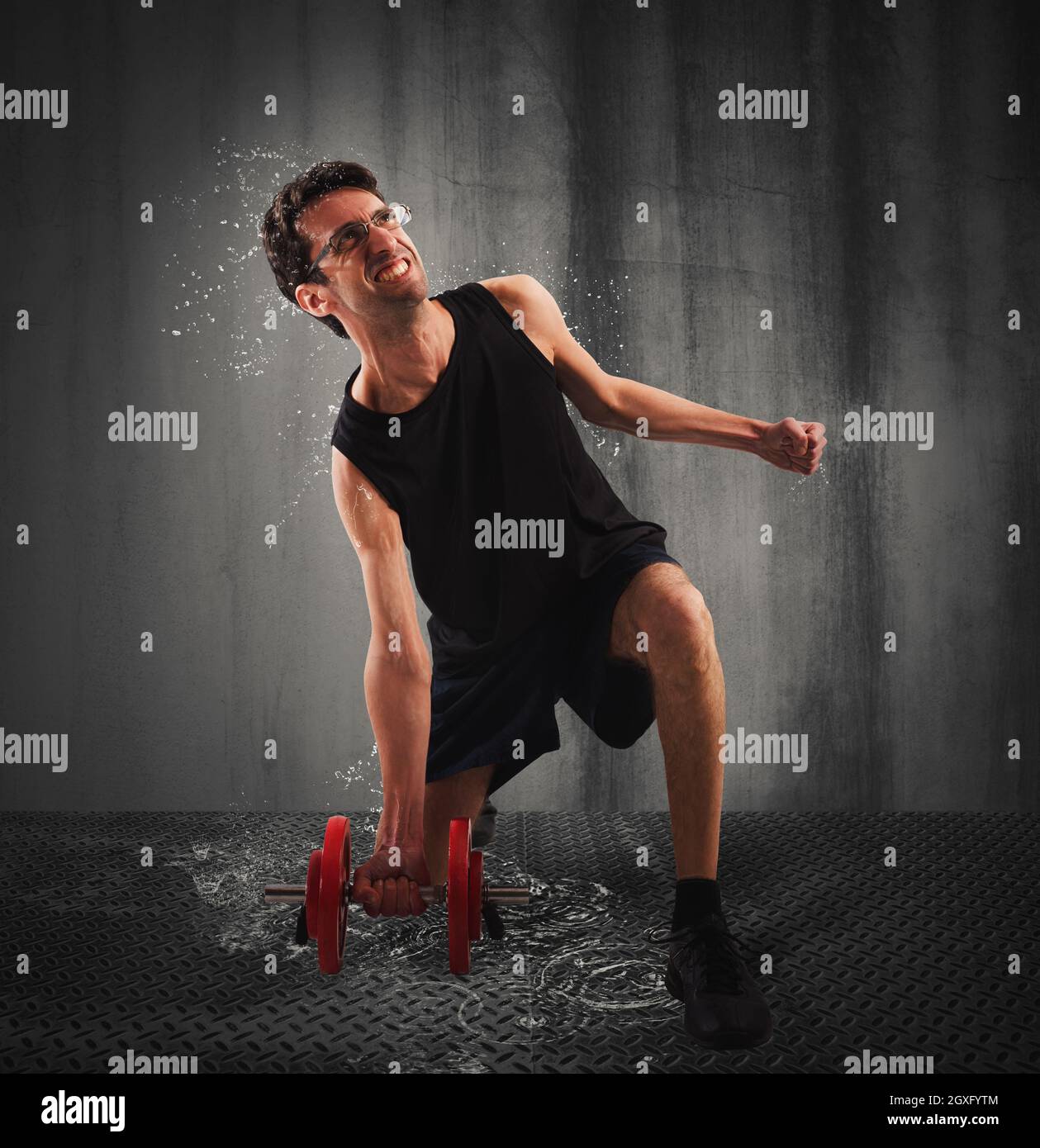 Thin man sweats raising a heavy weight Stock Photo - Alamy