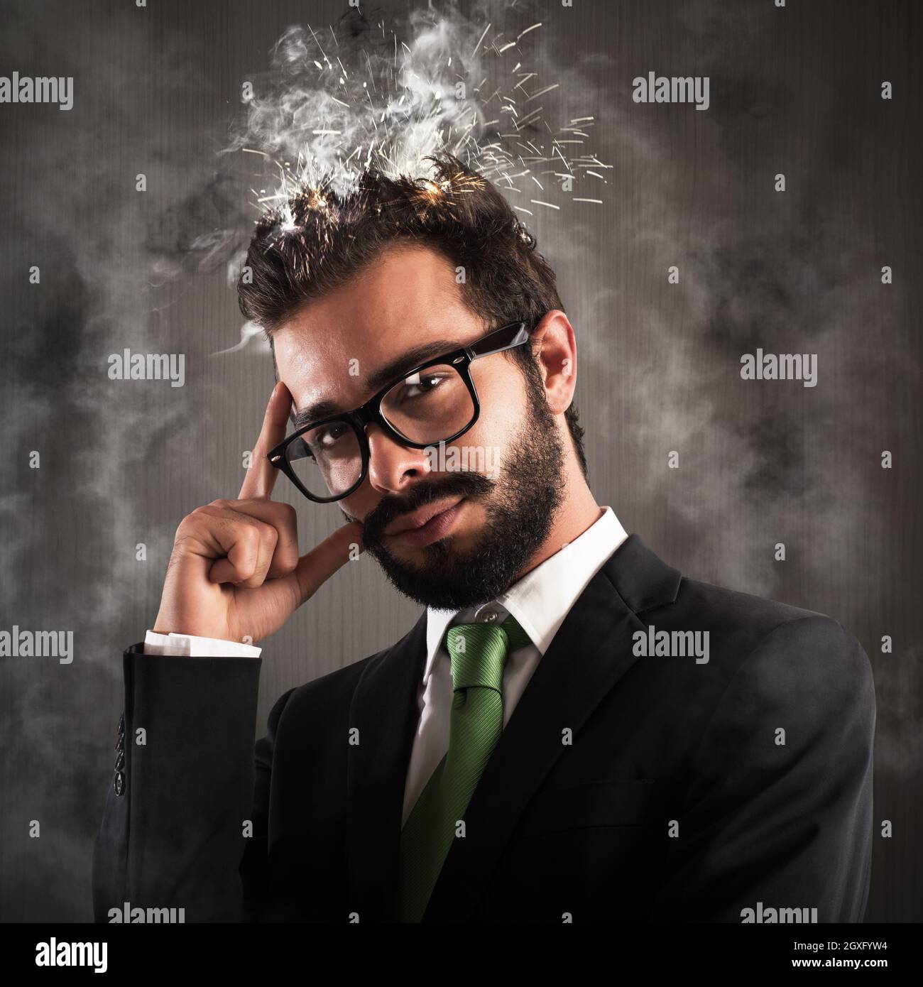 Stressed businessman with his head in smoke Stock Photo - Alamy