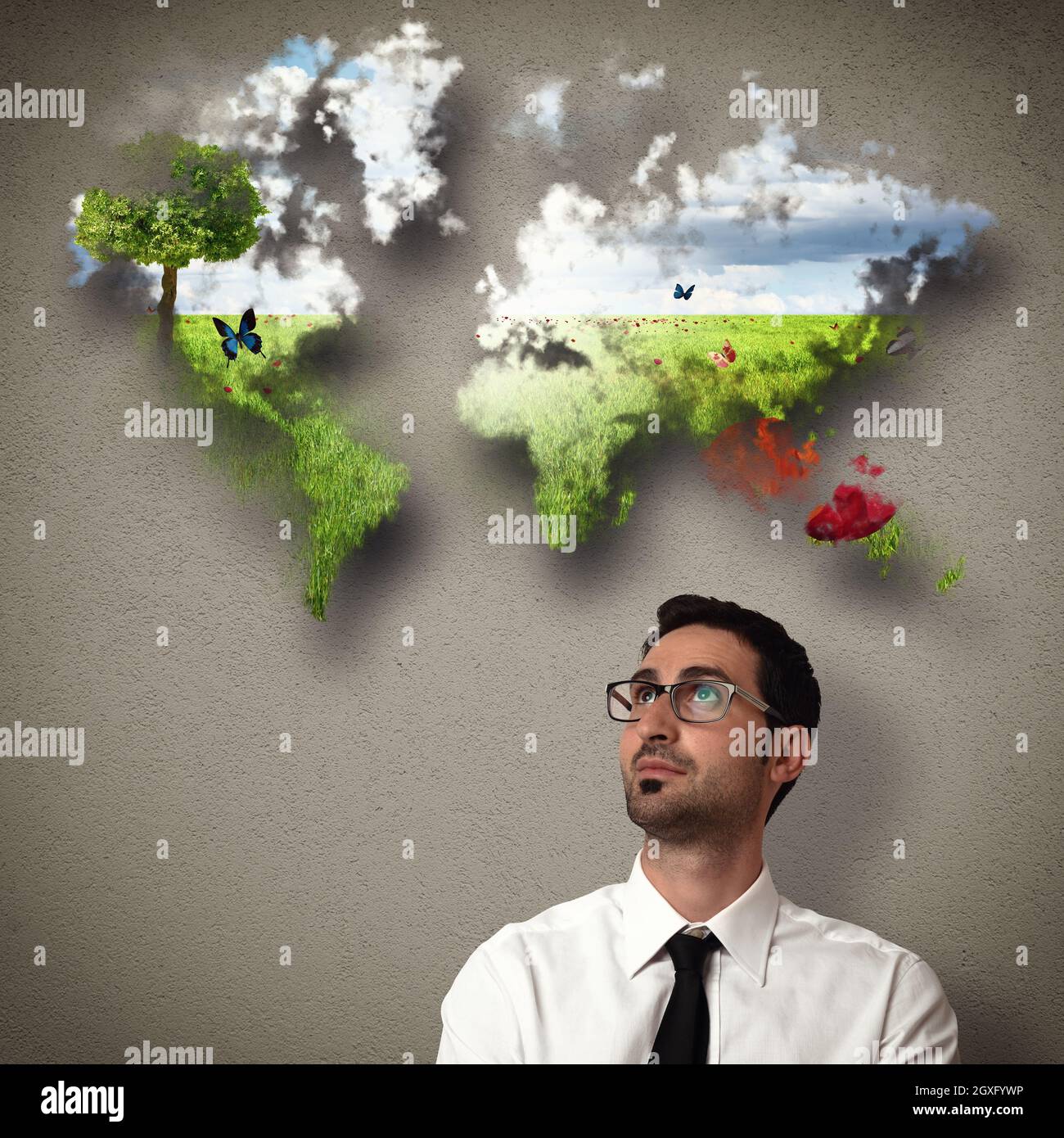 Business man imagines a natural clean world Stock Photo - Alamy