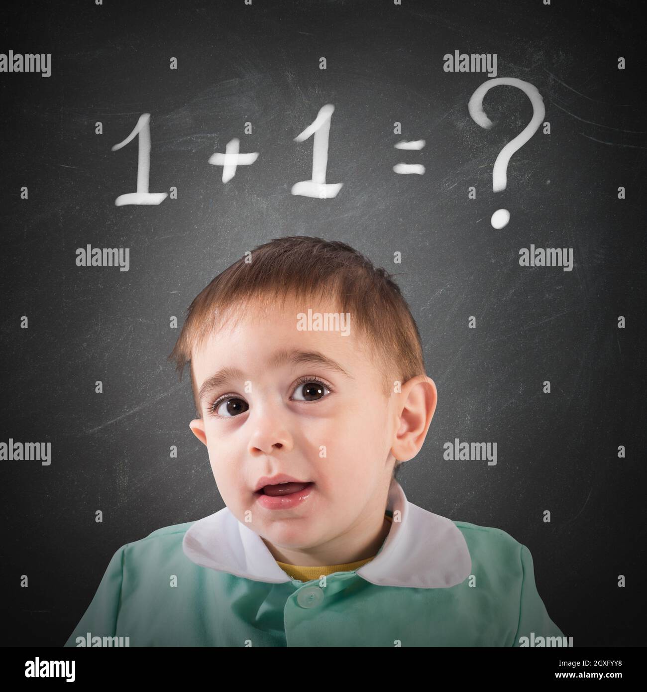 Little child with blackboard with math calculation Stock Photo - Alamy