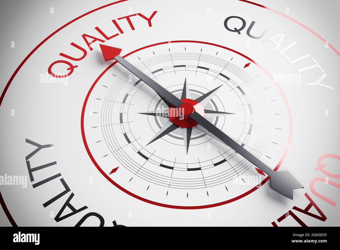 Compass arrow pointing to the word quality Stock Photo - Alamy