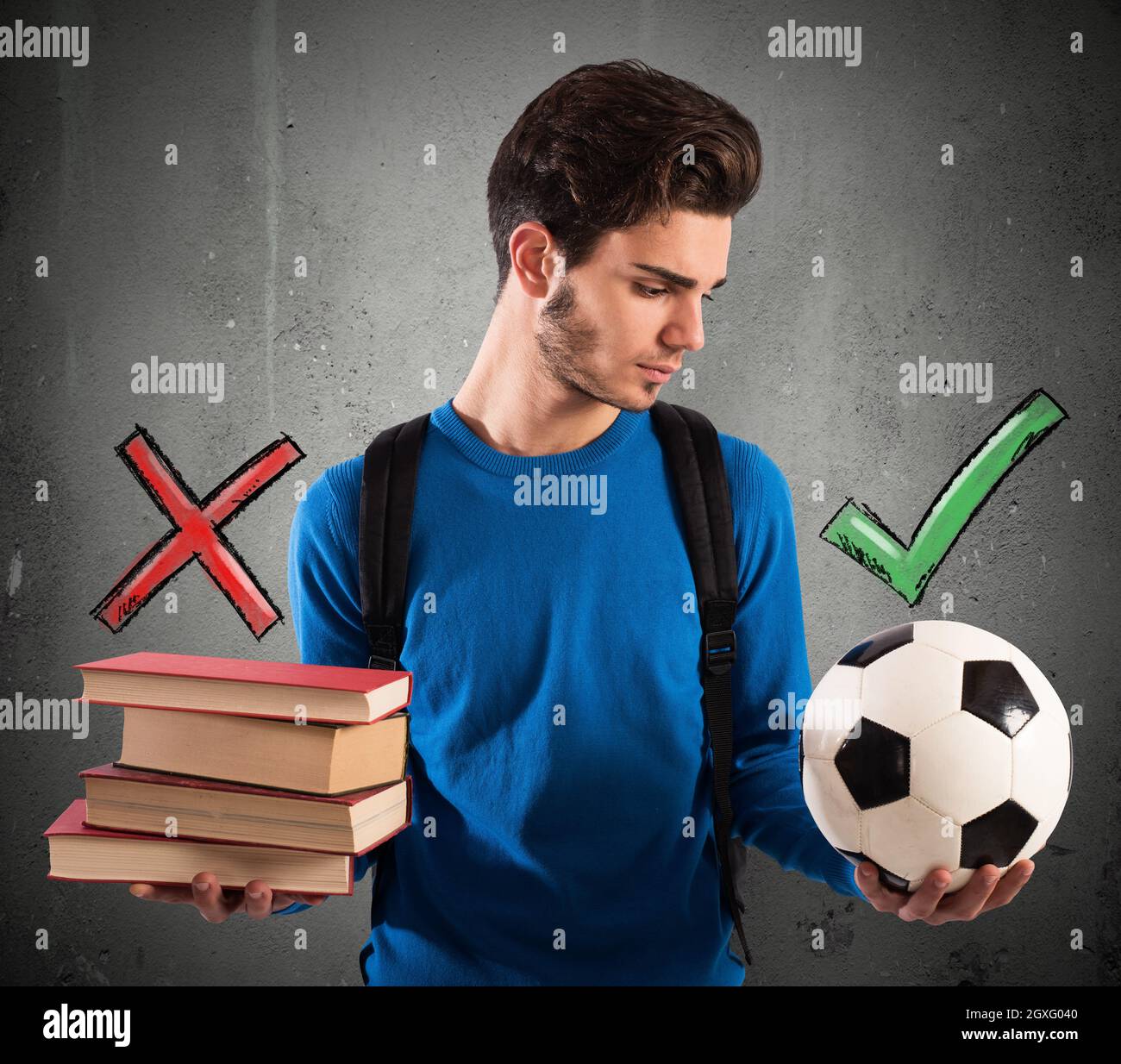 Boy chooses the ball instead of books Stock Photo - Alamy