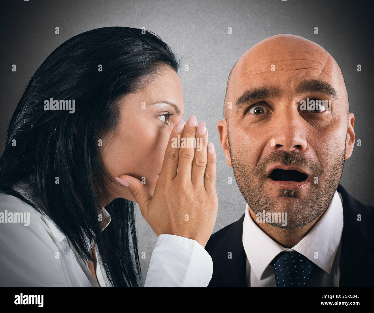 Woman talking in secret to a man Stock Photo - Alamy