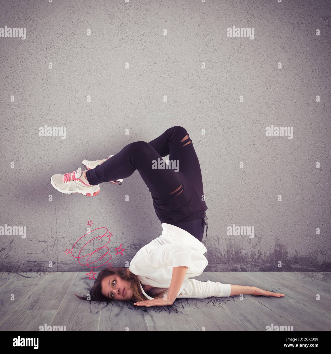 Girl dancer of breakdance hits her head Stock Photo - Alamy