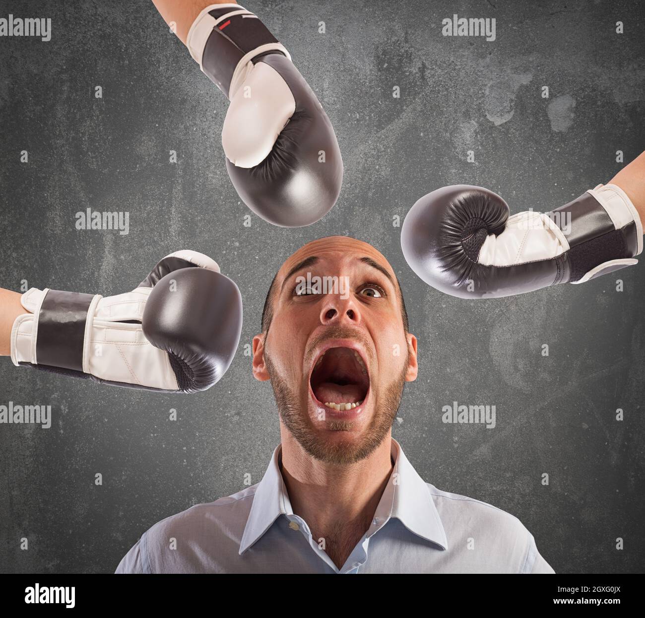 Many boxing punches hit an afraid businessman Stock Photo - Alamy