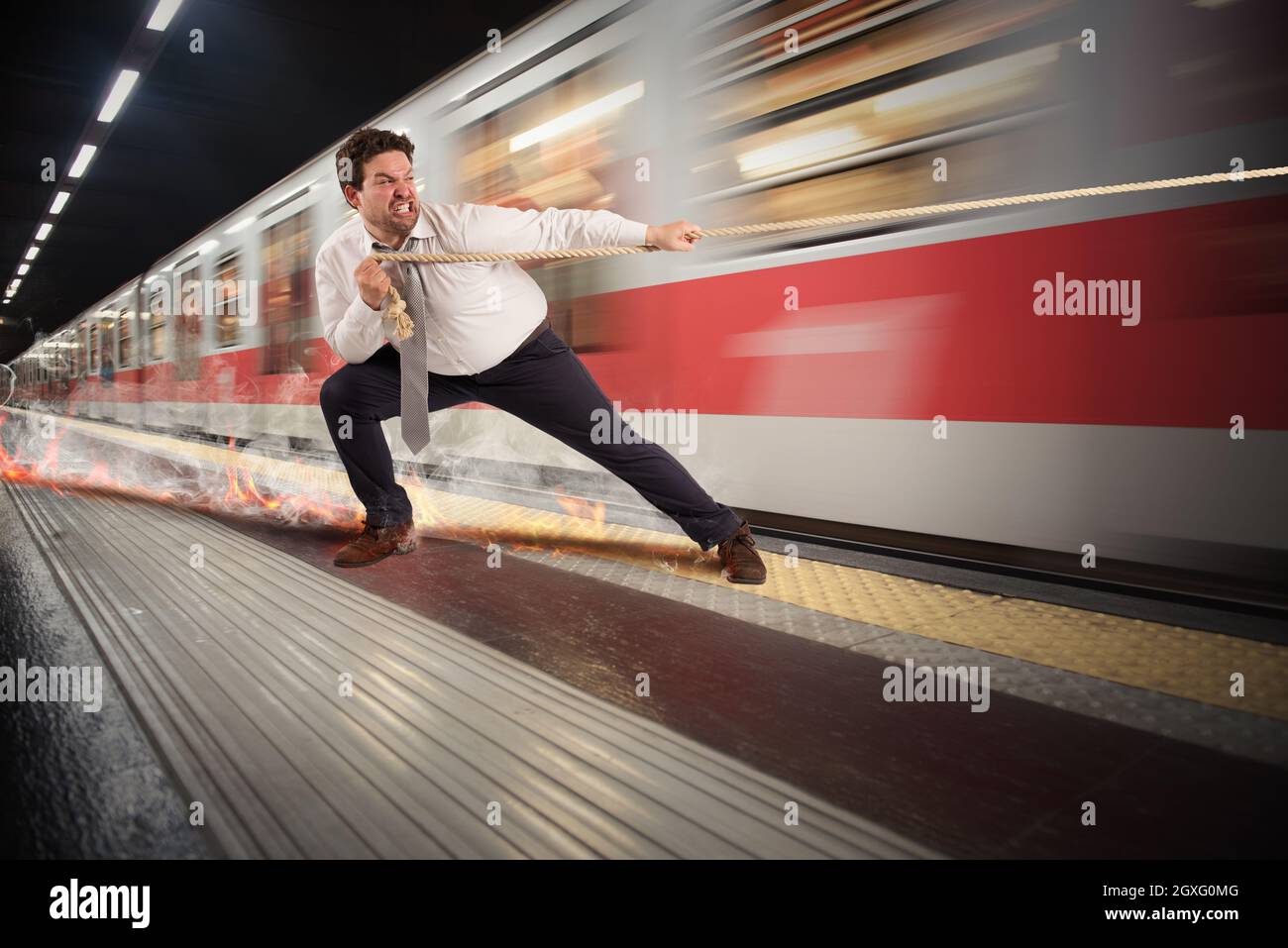 Man tries to stop the fast train Stock Photo - Alamy