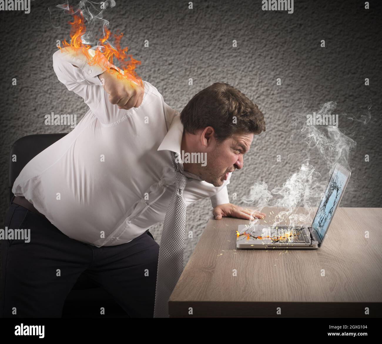Angry man gives fiery fist to computer Stock Photo - Alamy