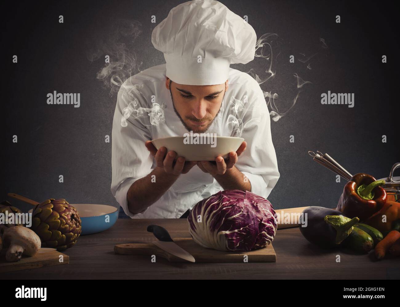 Chef smelling the aroma of a dish Stock Photo - Alamy