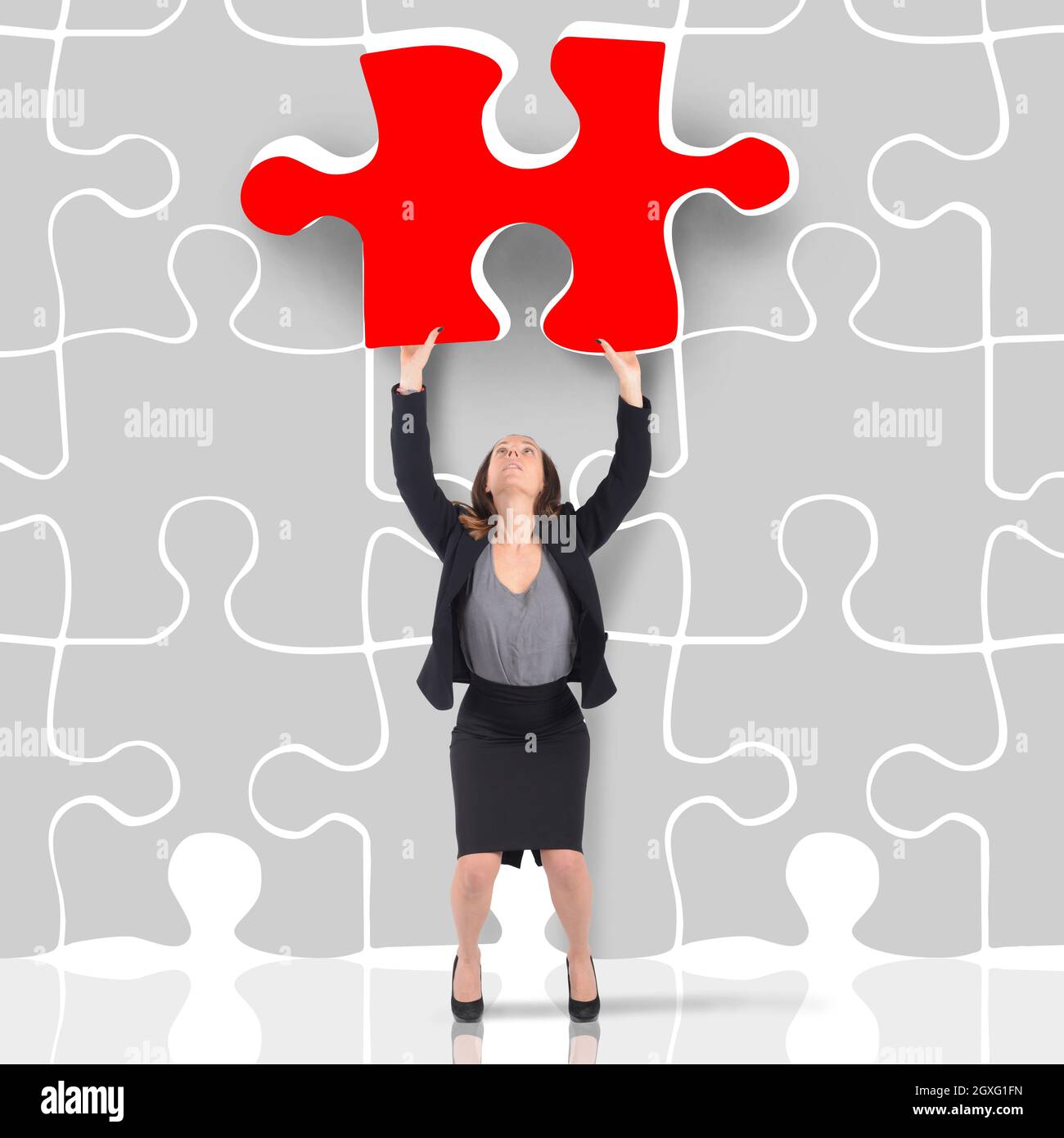 Woman enters a red missing puzzle piece Stock Photo - Alamy
