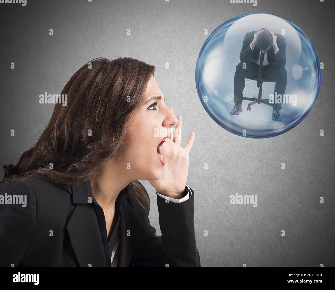 Woman yelling to man inside a bubble Stock Photo - Alamy