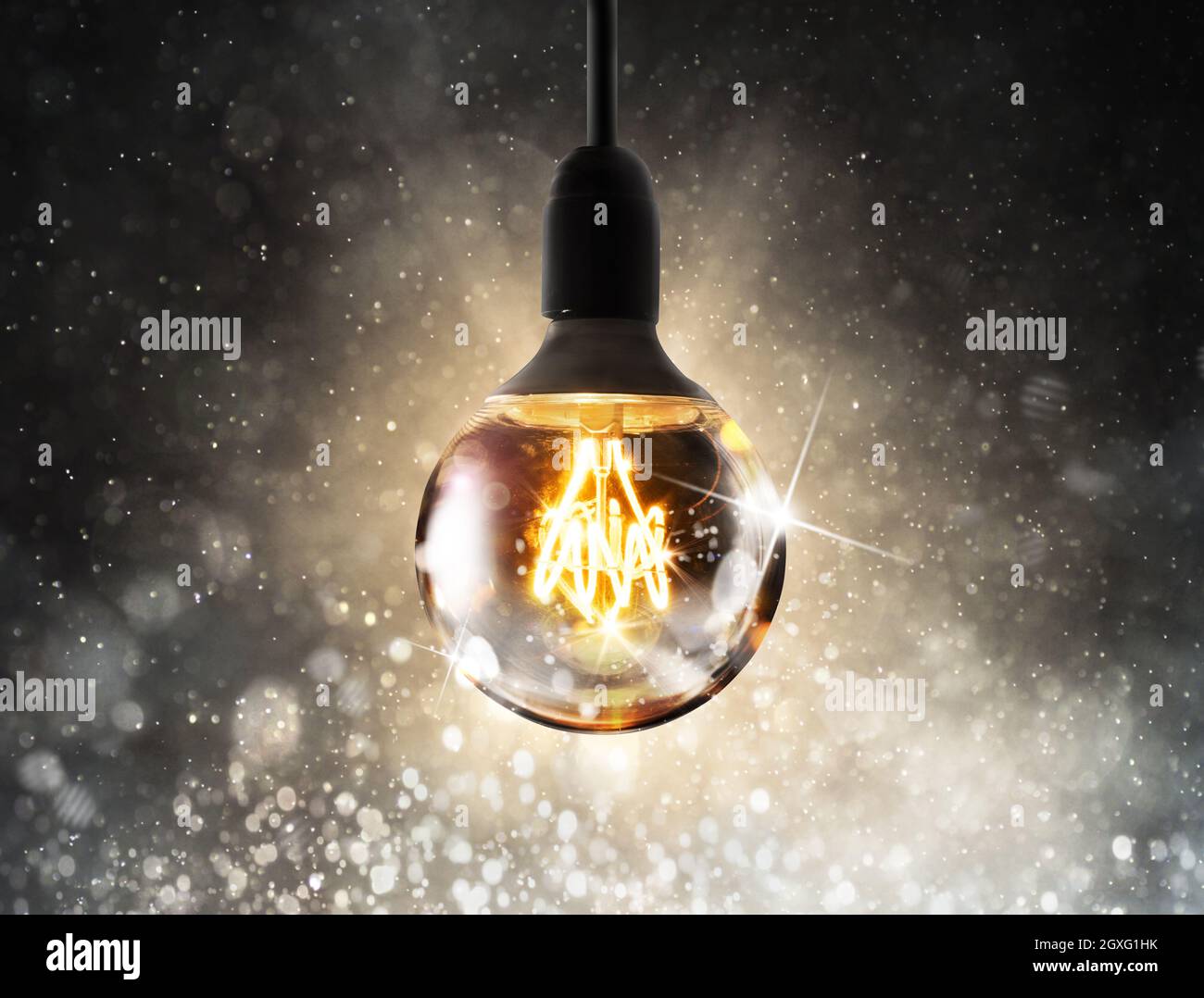 Big light bulb shining with sparkling background Stock Photo - Alamy