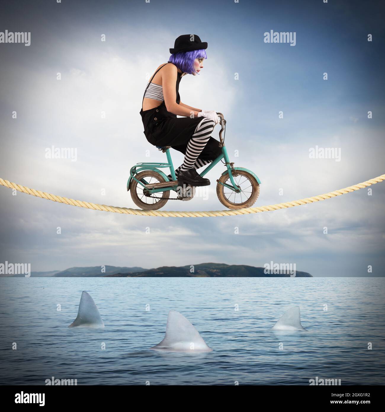 Clown on a bicycle on a rope Stock Photo - Alamy