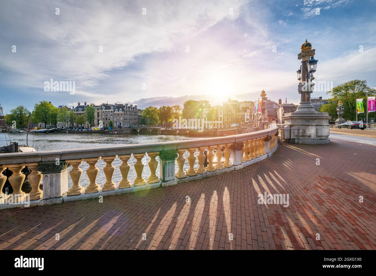 Bright sun on Blue bridge in Amsterdam, Holland Stock Photo - Alamy