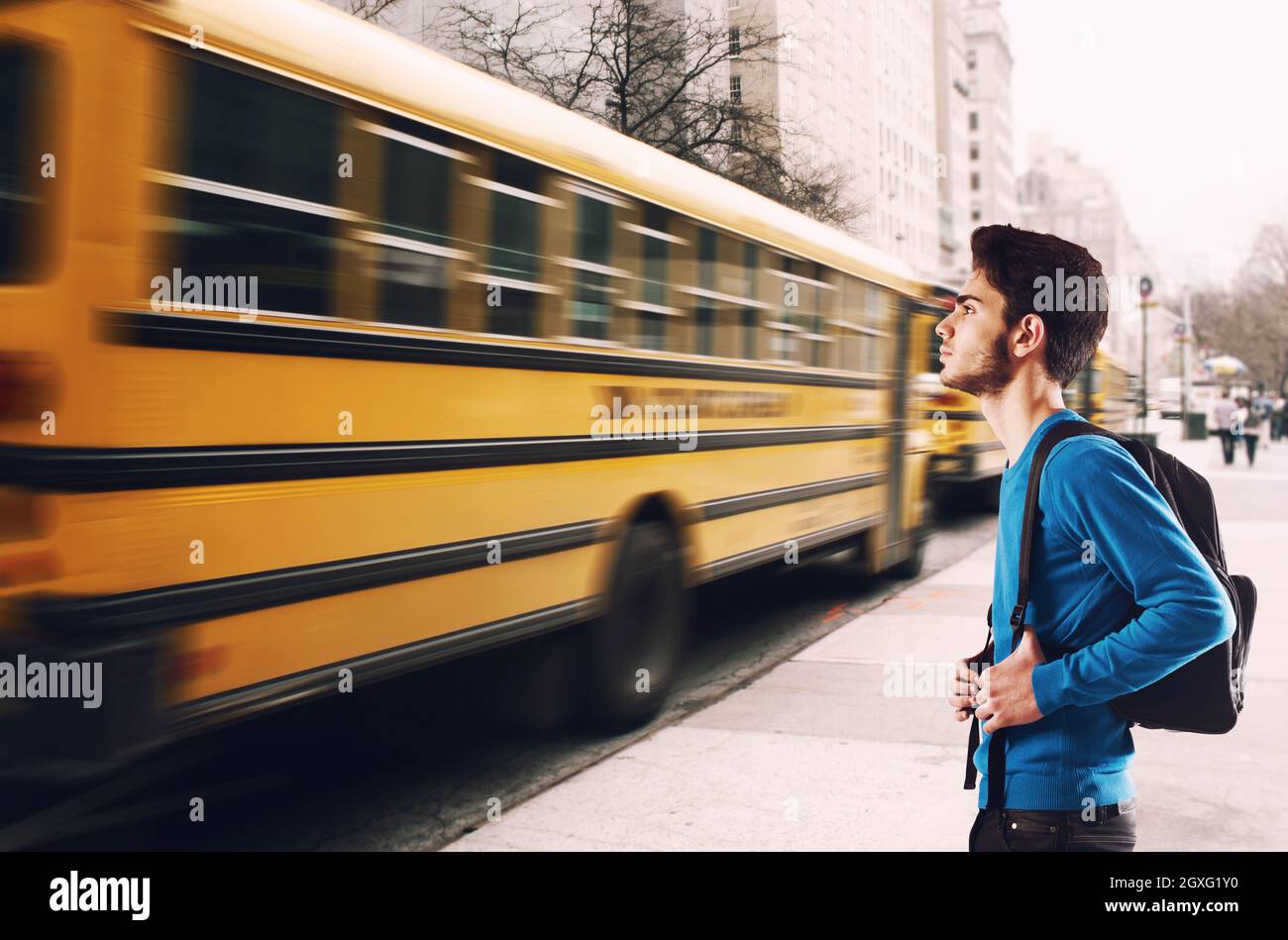 Teenager student with backpack waiting for bus Stock Photo - Alamy