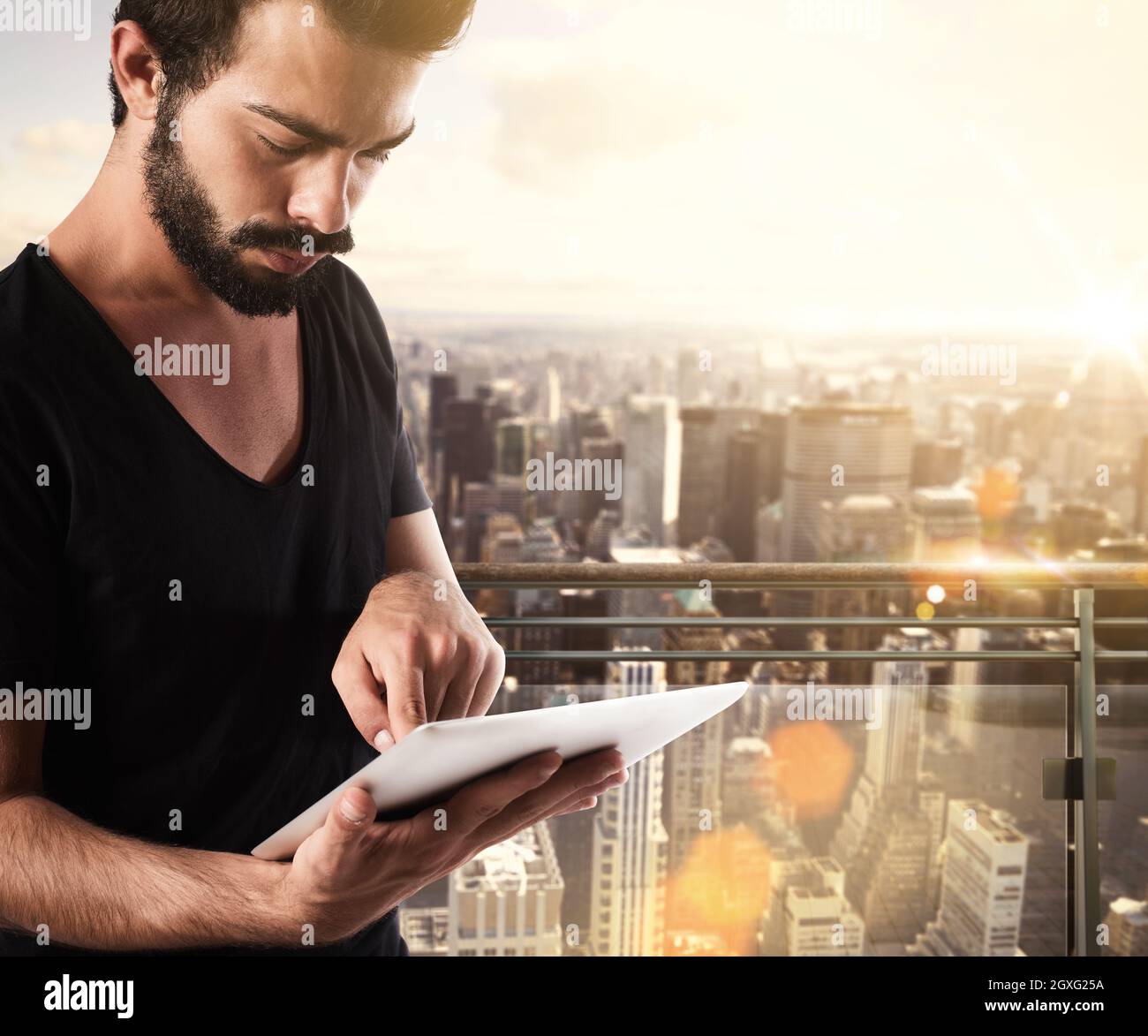 Man touches the tablet with background cityscape Stock Photo - Alamy