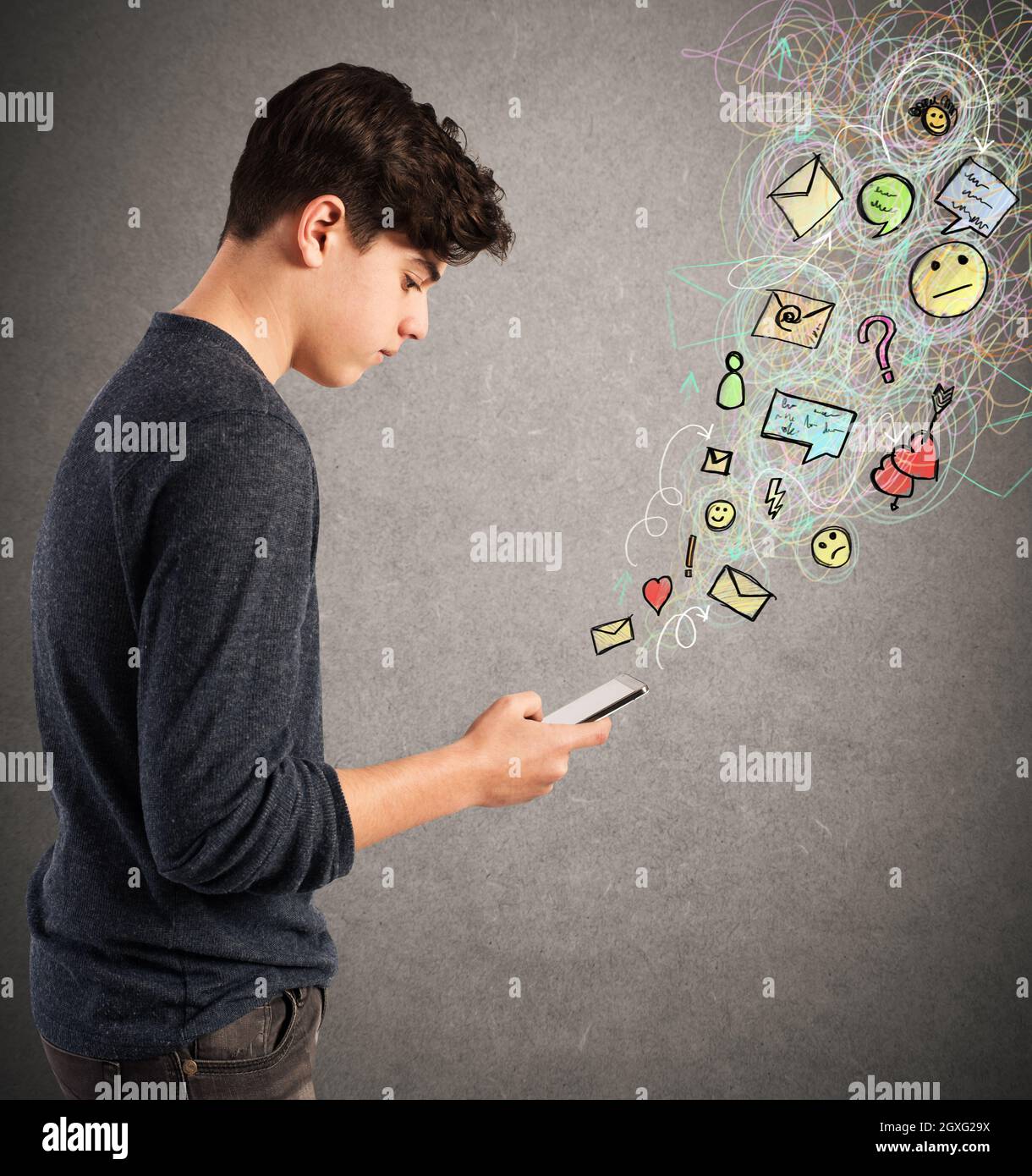 Teen boy writes on screen of his cellphone Stock Photo - Alamy