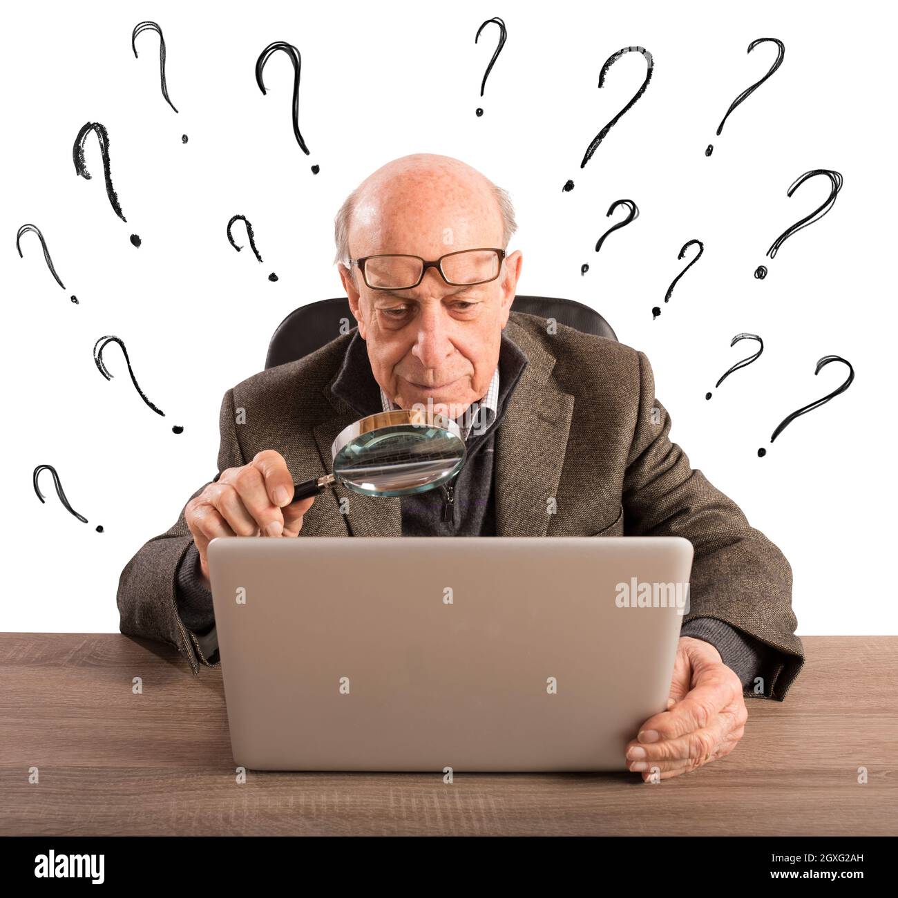 Confused elderly man looks at the computer Stock Photo - Alamy