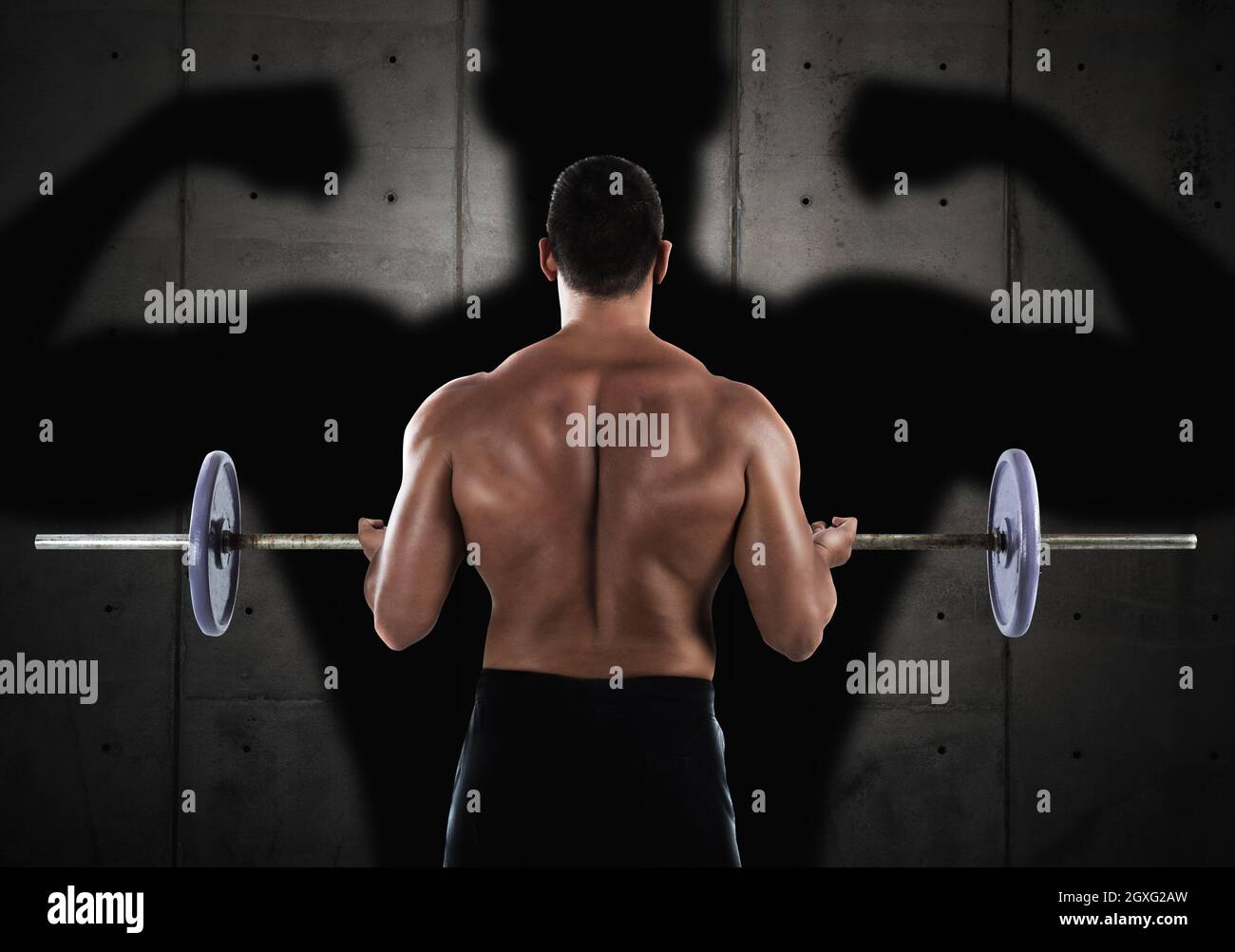 Back of muscular man training with a barbell Stock Photo - Alamy