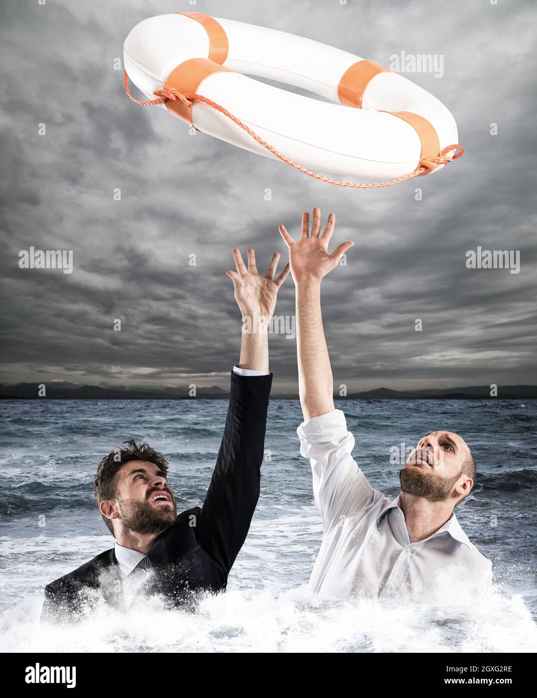 Lifesaver launched a drowning business men in the sea Stock Photo - Alamy
