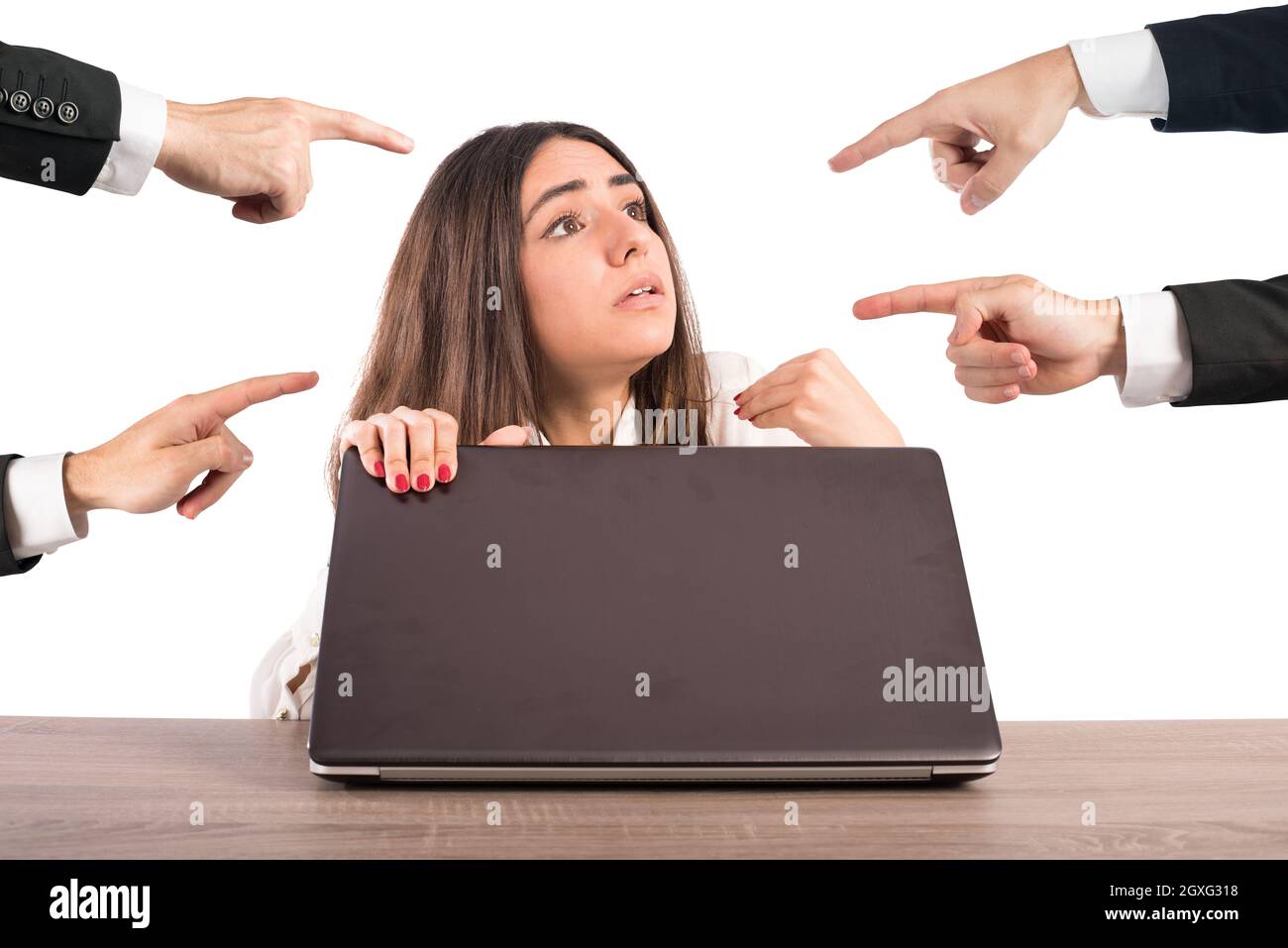People pointing a woman hidden behind a computer Stock Photo - Alamy