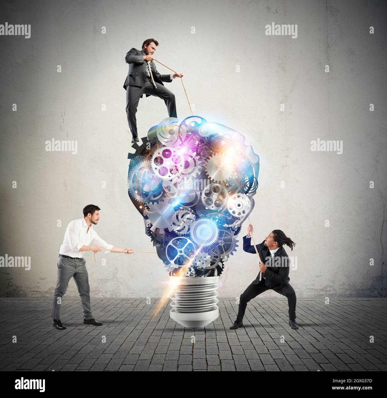 Teamwork of businesspeople work together to a lightbulb system of gears ...