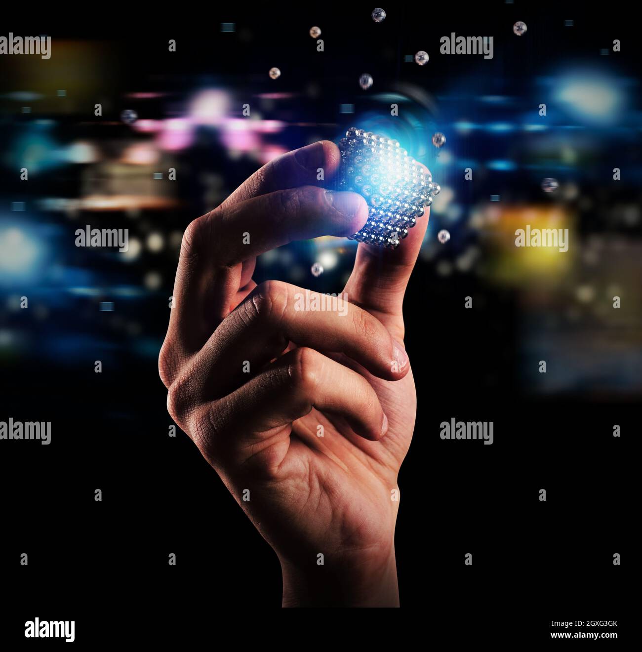 Cube of magnet spheres held by a hand. concept of union and partnership ...