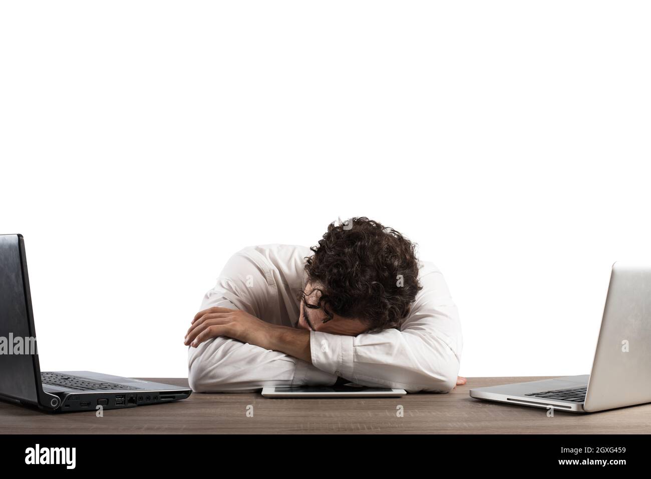 Man exhausted from overwork sleeping over computer Stock Photo - Alamy