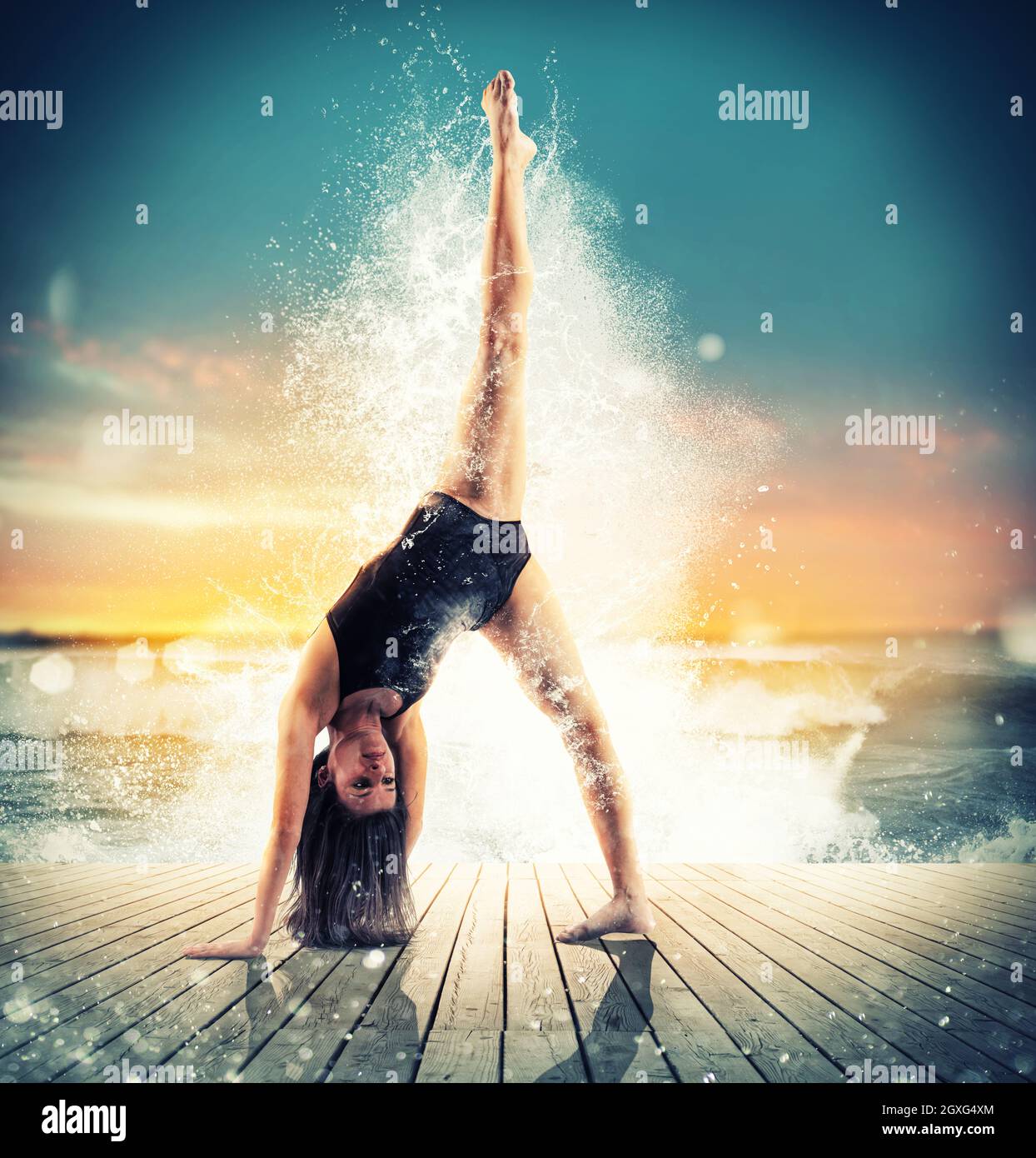 Classical dancer dancing on a floating dock with sea splash Stock Photo ...