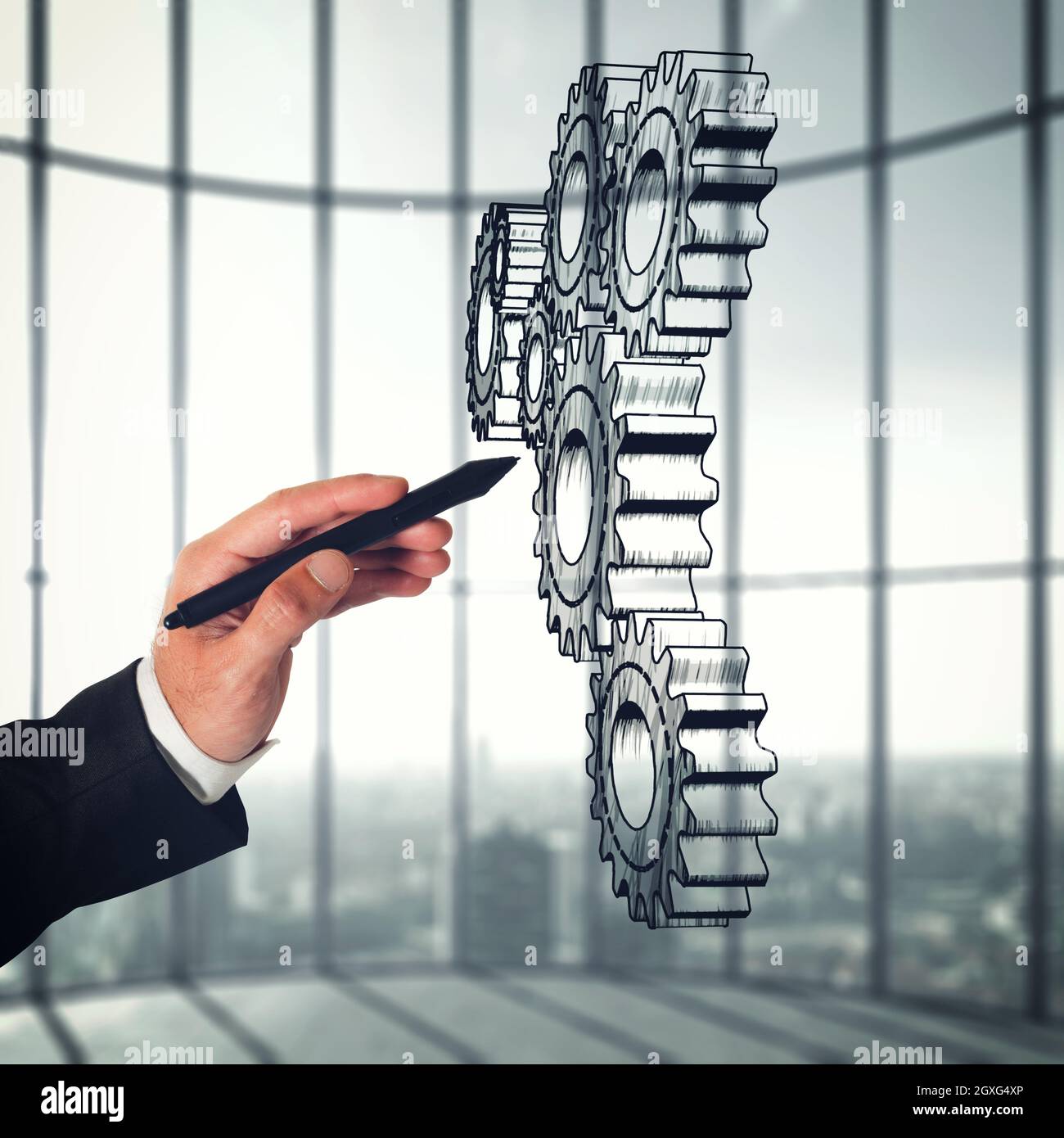 Businessman draws a System of a mechanism gears move together Stock ...