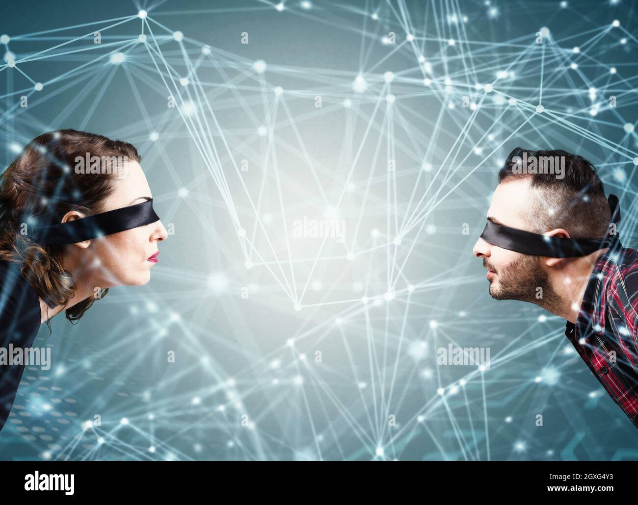 Woman and man blindfolded in a interconnection spheres connected each ...