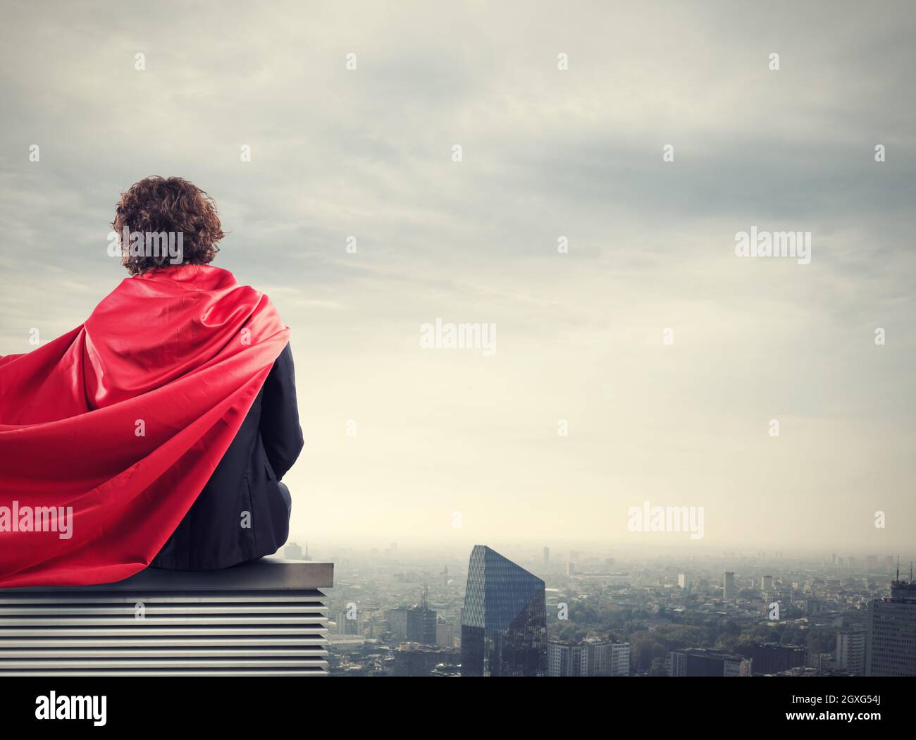 Businessman with a superhero cape view from above the city Stock Photo ...