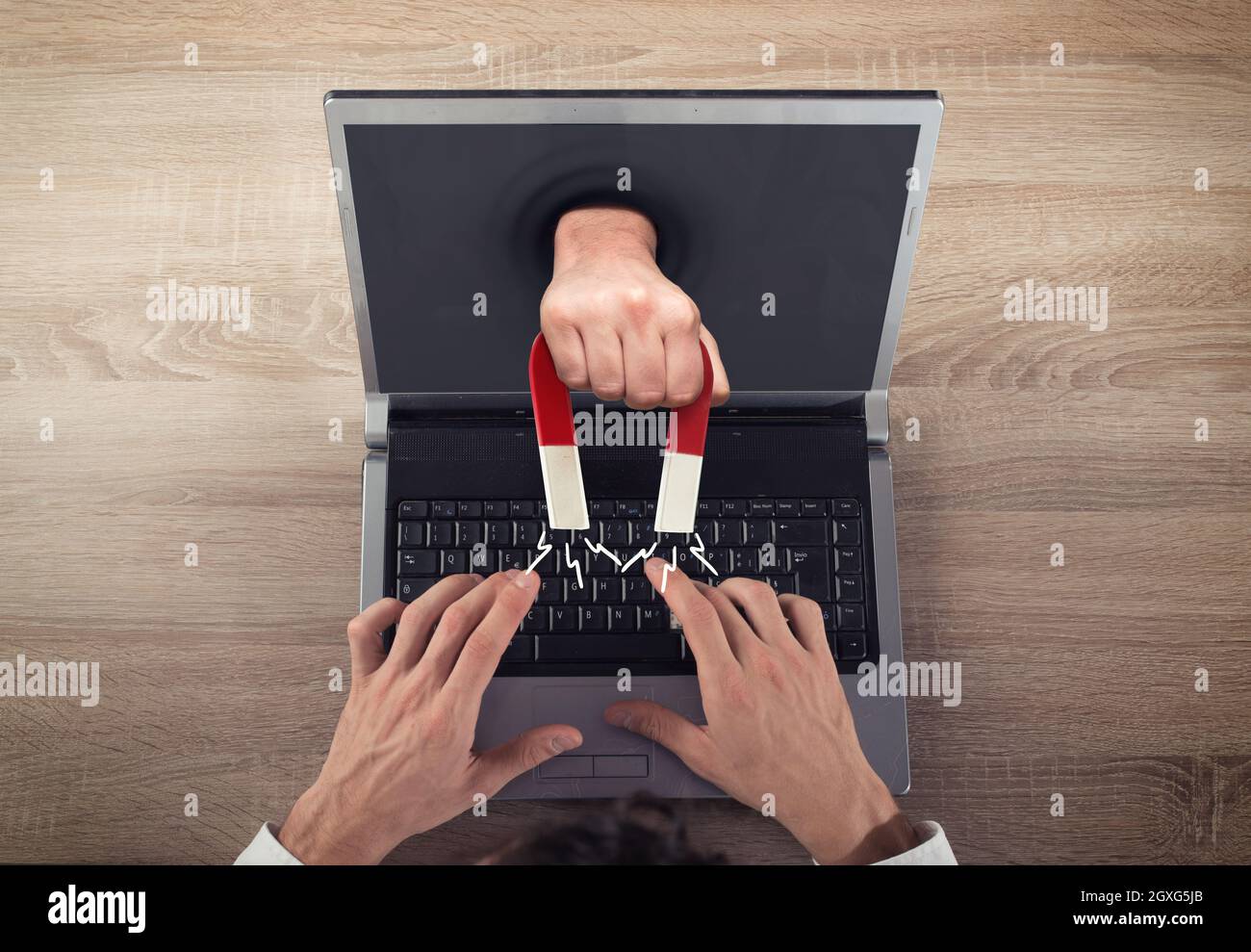Magnet attracts a man to a computer. Capturing people with marketing ...