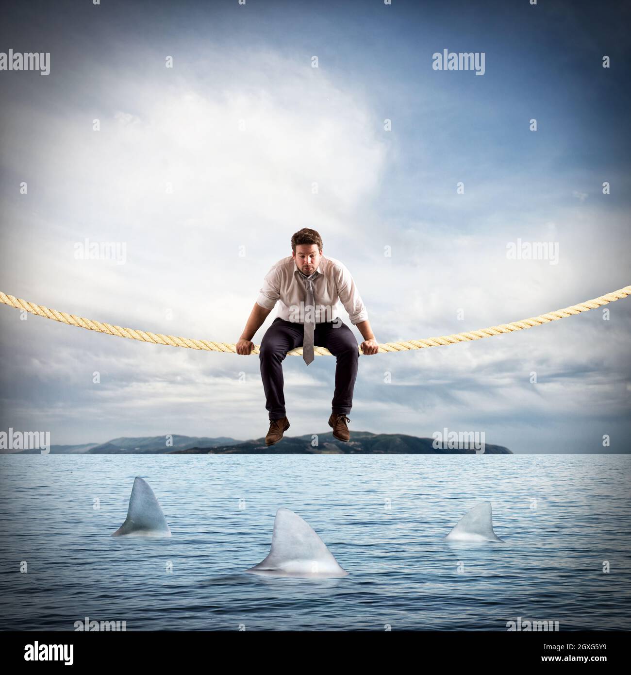 Man sitting on a rope over the sea with sharks. Concept of difficult ...