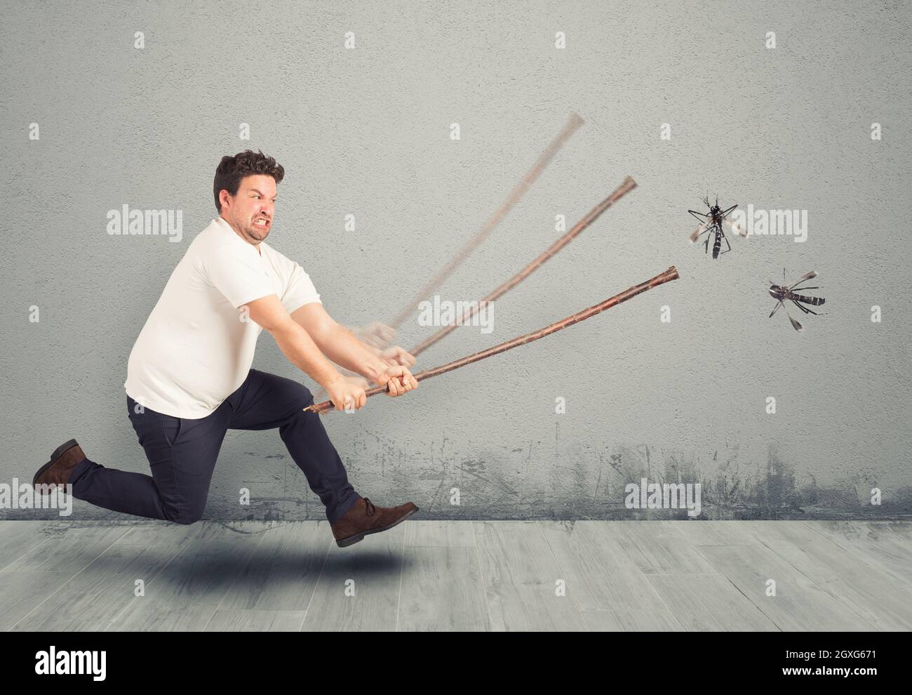 Angry Man strikes with the stick big mosquitoes Stock Photo - Alamy