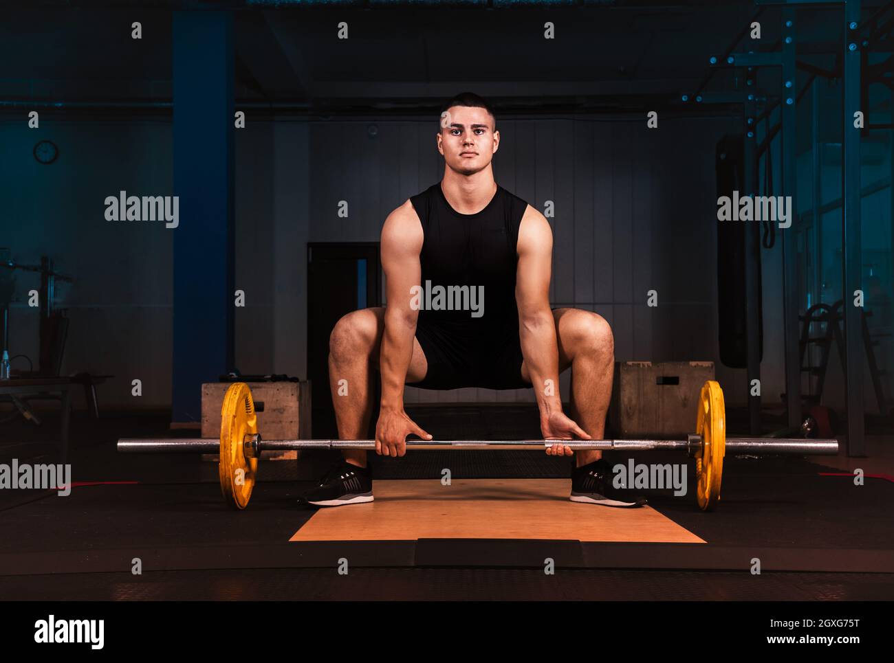 A young guy works out in the gym Stock Photo - Alamy