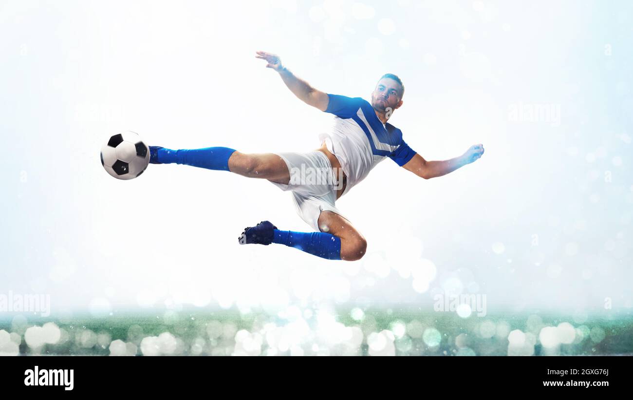 Football scene with a player who kicks the ball on the fly at the ...