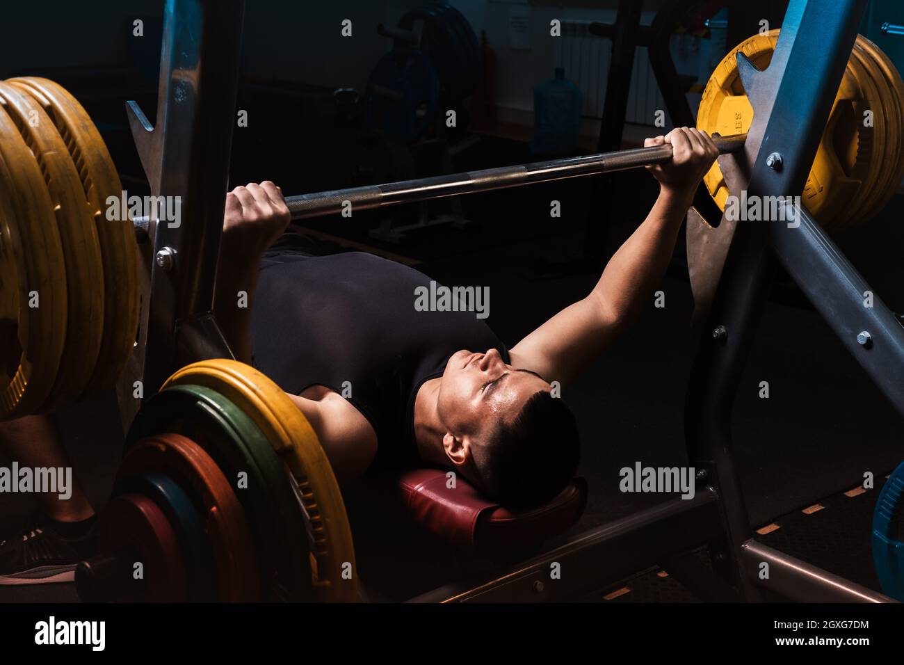 A young guy works out in the gym Stock Photo - Alamy