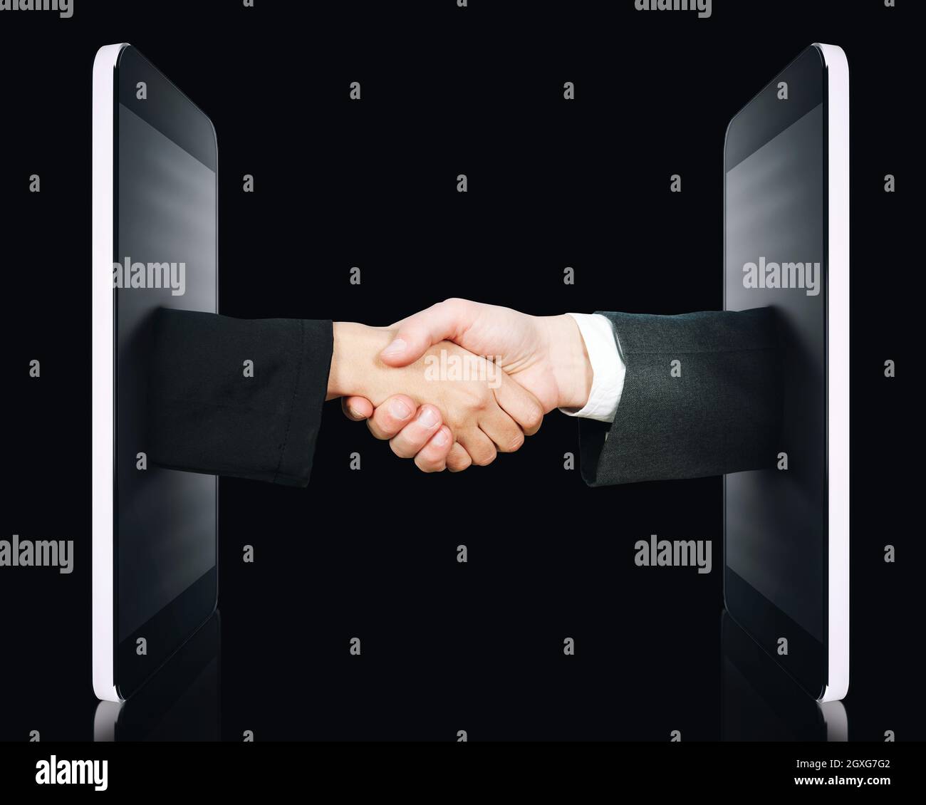 Handshake between two people behind a mobile phone Stock Photo - Alamy