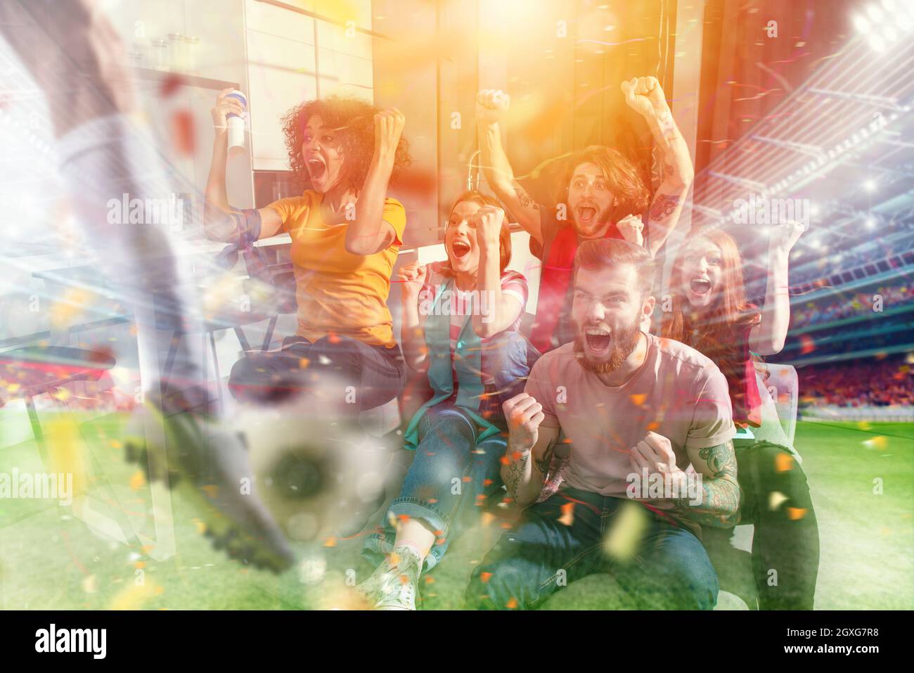 Happy friends of football fans watching soccer on tv and celebrating ...