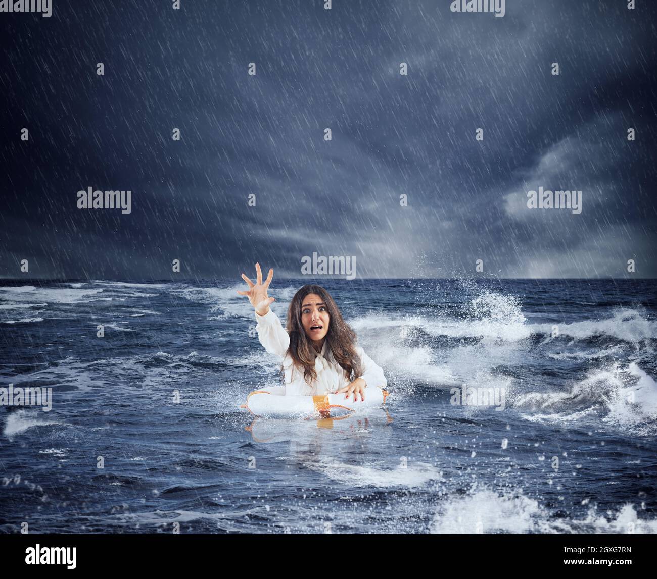 Help request from a worker who is drowning in the sea Stock Photo - Alamy