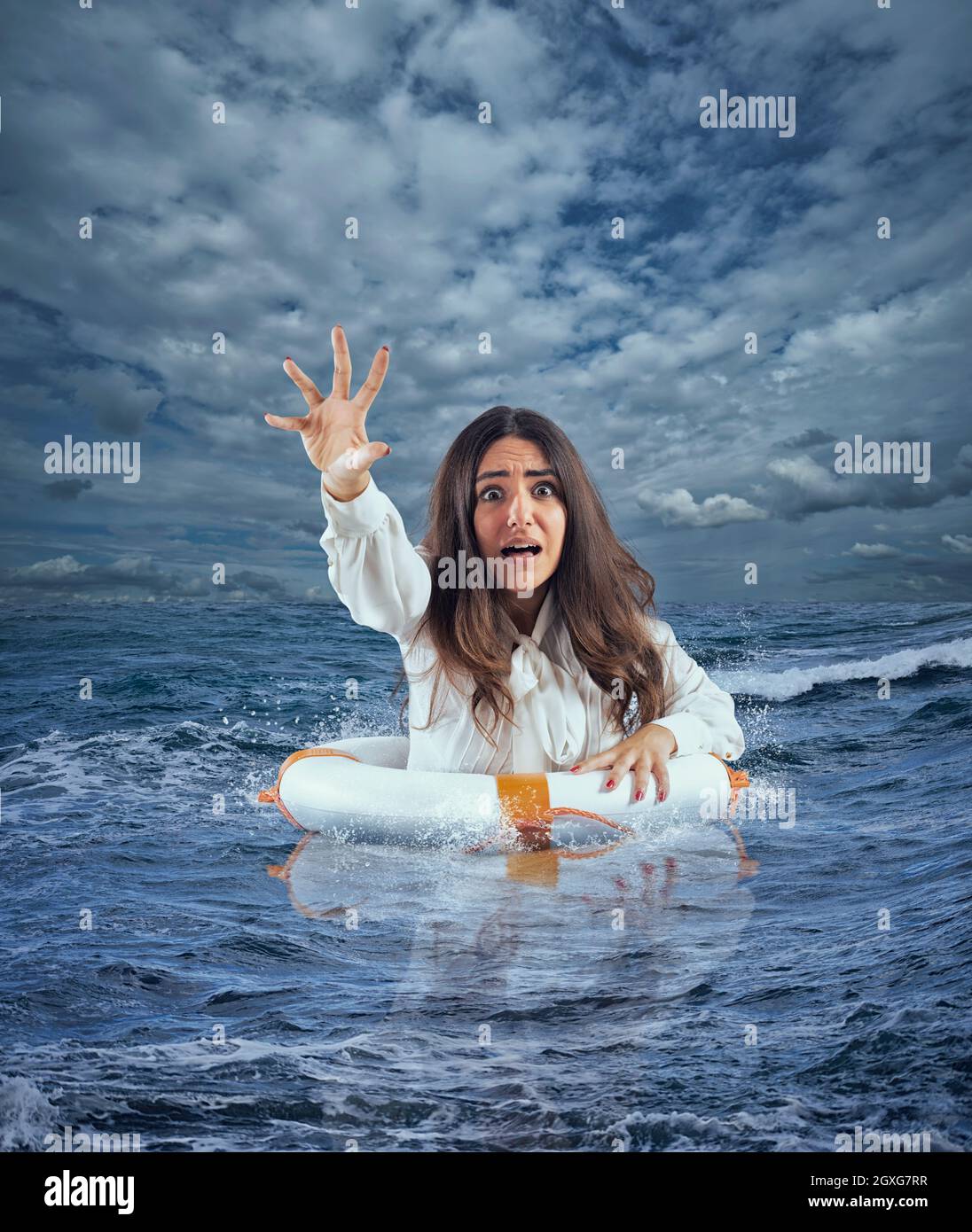 Help request from a worker who is drowning in the sea Stock Photo - Alamy